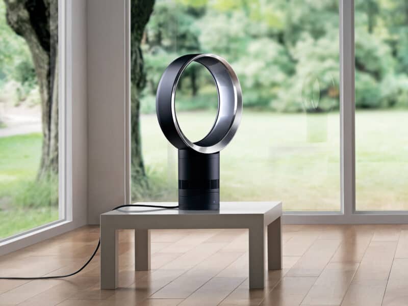 Who invented the bladeless fan and how does it work?